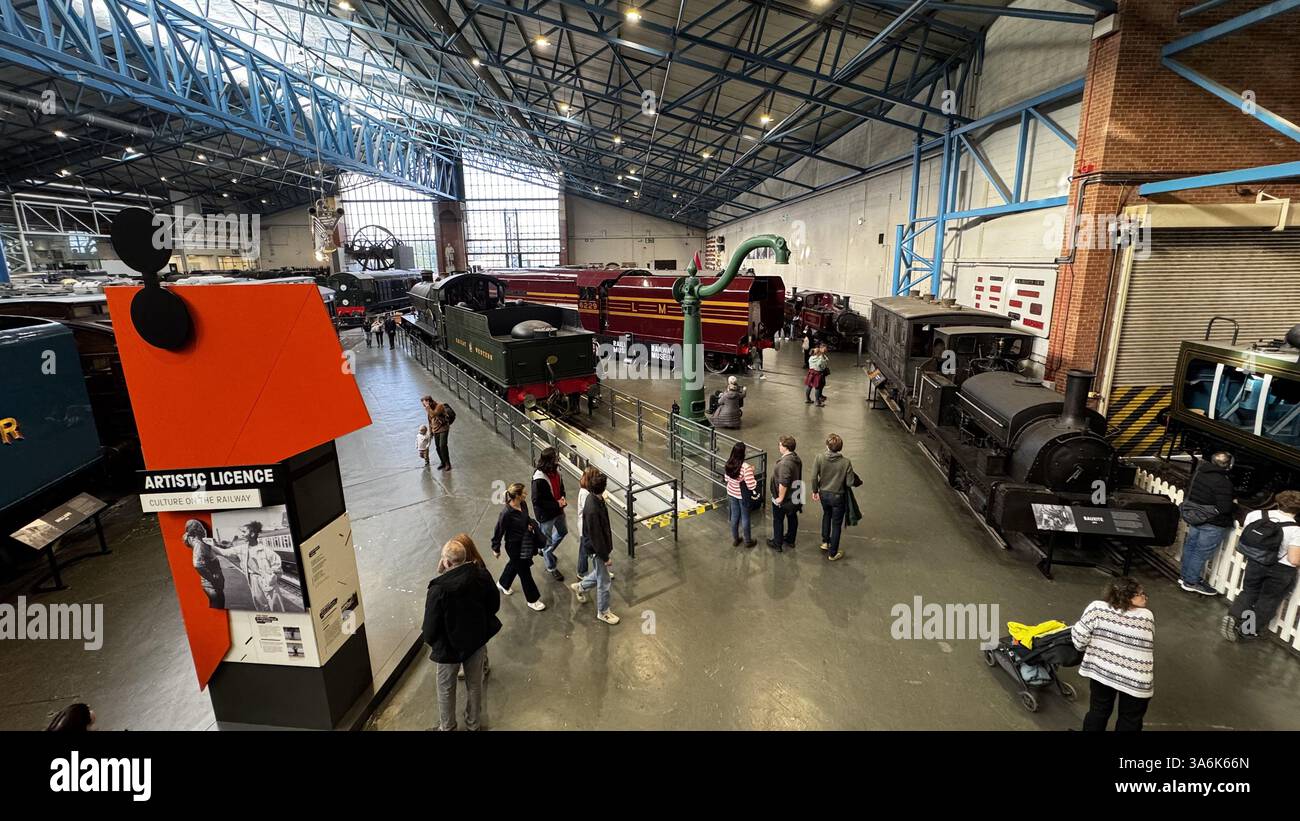 Interior view of a railway museum, featuring several locomotives and ...