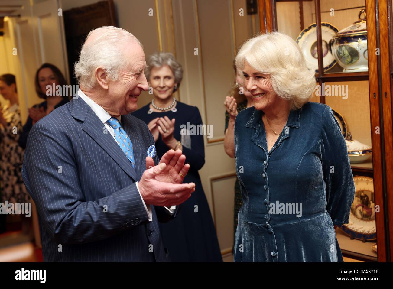 Queen Camilla, joined by King Charles III, during a reception at Clarence House, London, for ...