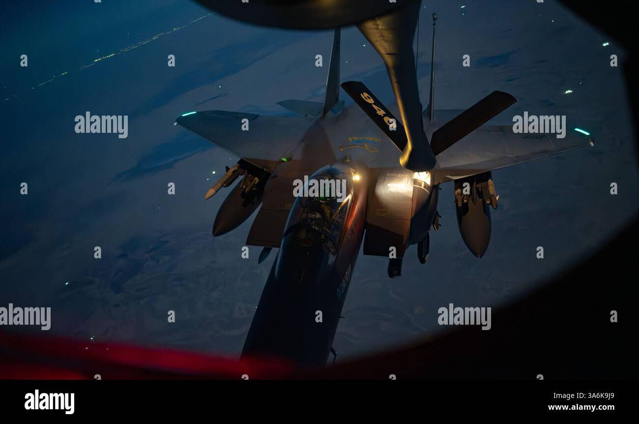 A U.S. Air Force F-15E Strike Eagle is refueled over the U.S. Central ...