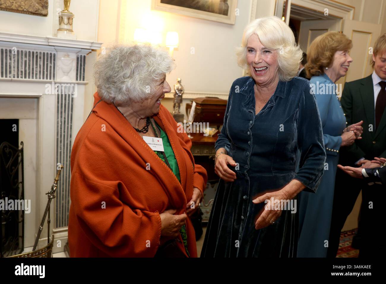 Queen Camilla speaks to Miriam Margolyes during a reception at Clarence ...