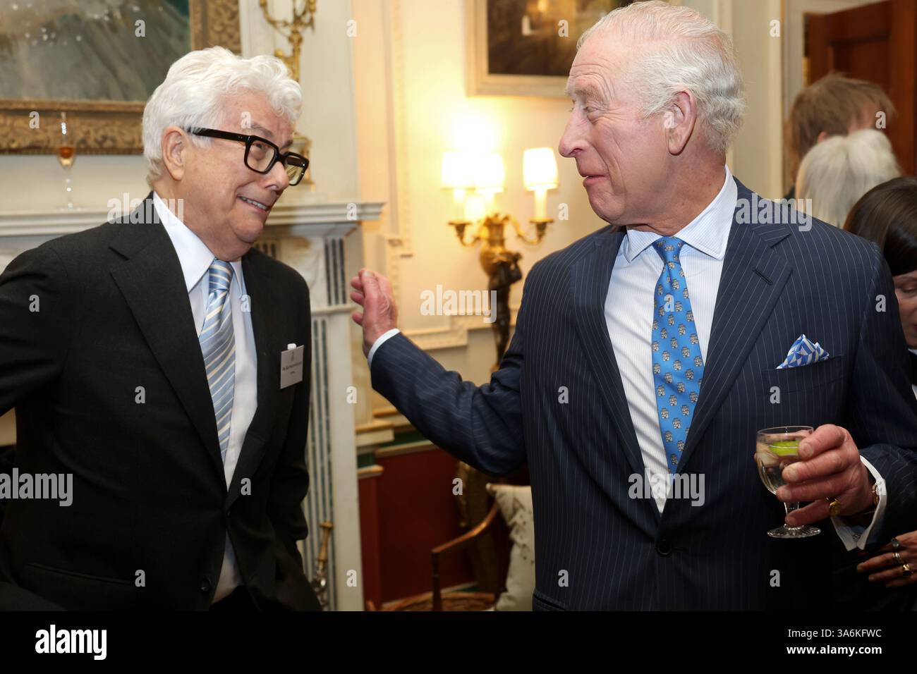 Ken Follett speaks to King Charles III during a reception at Clarence House, London, for authors ...
