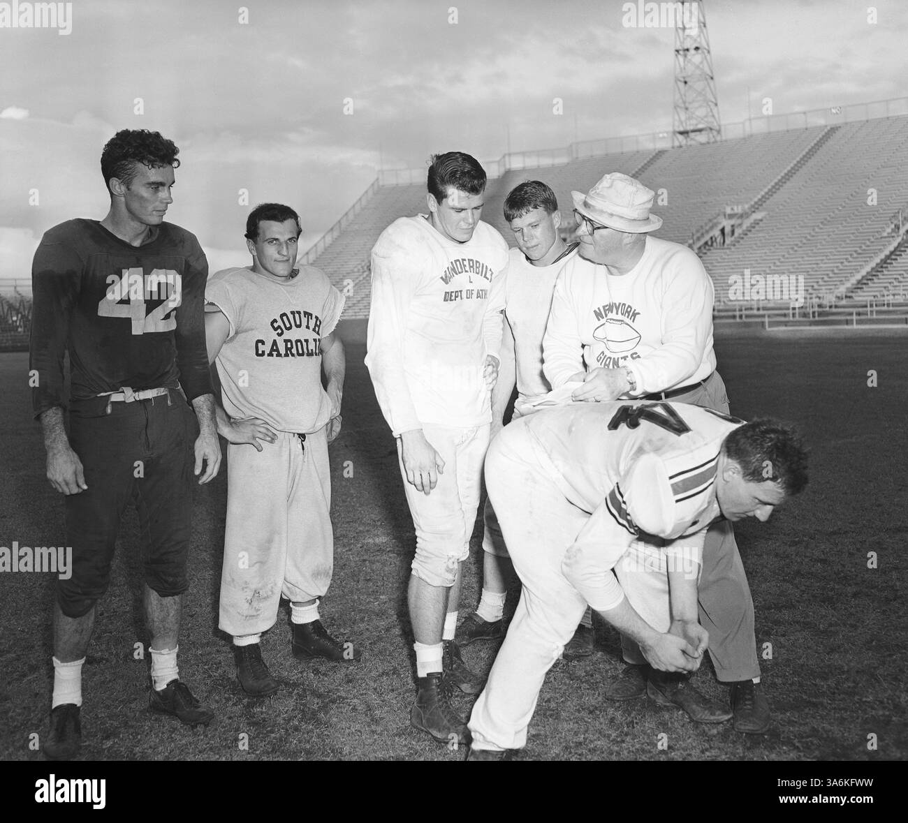 Coach Steve Owen of the New York Giants, standing right, explains a ...