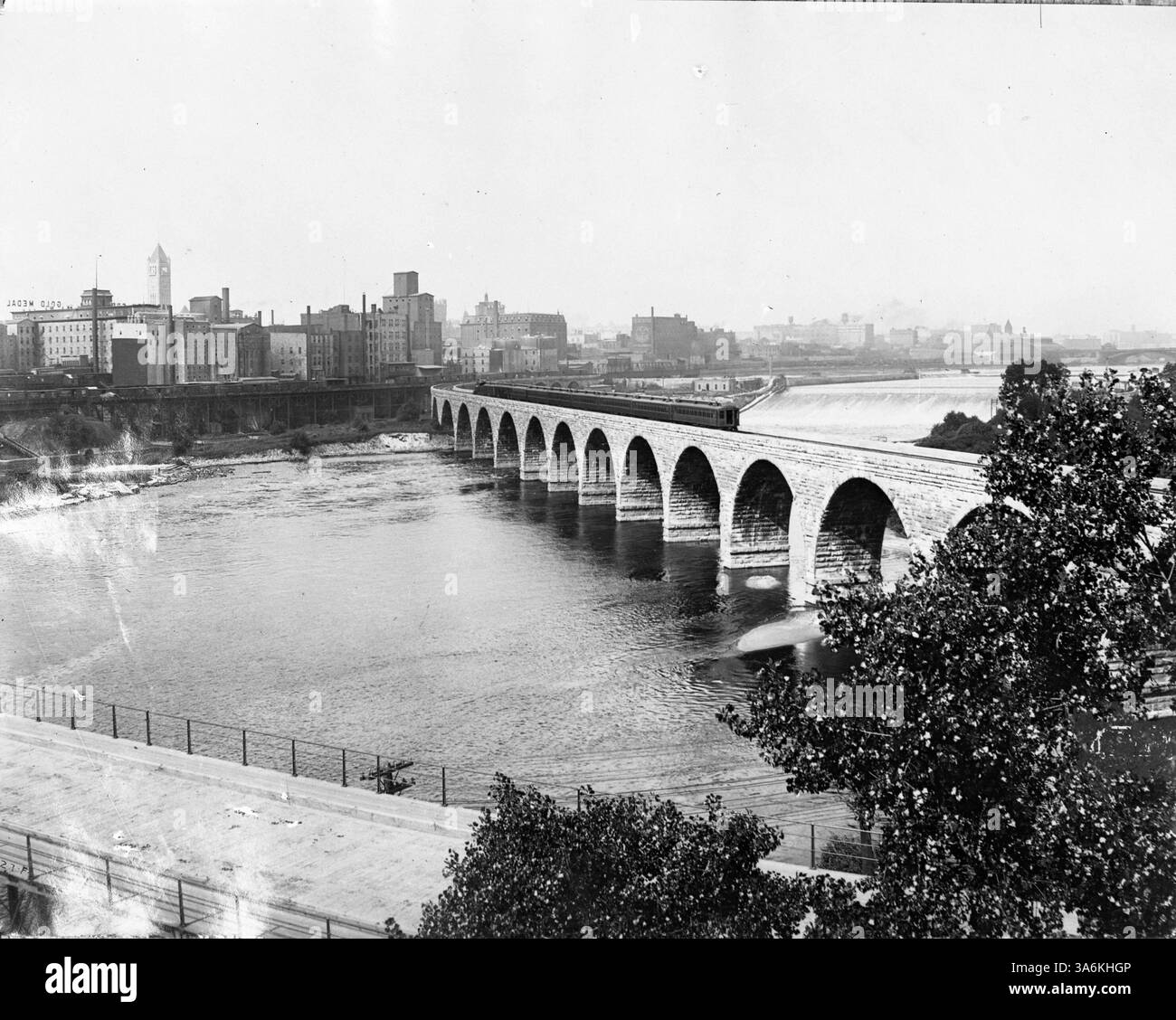 The Great Northern Stone Arch Bridge, visible in this historic image, spans the Mississippi ...