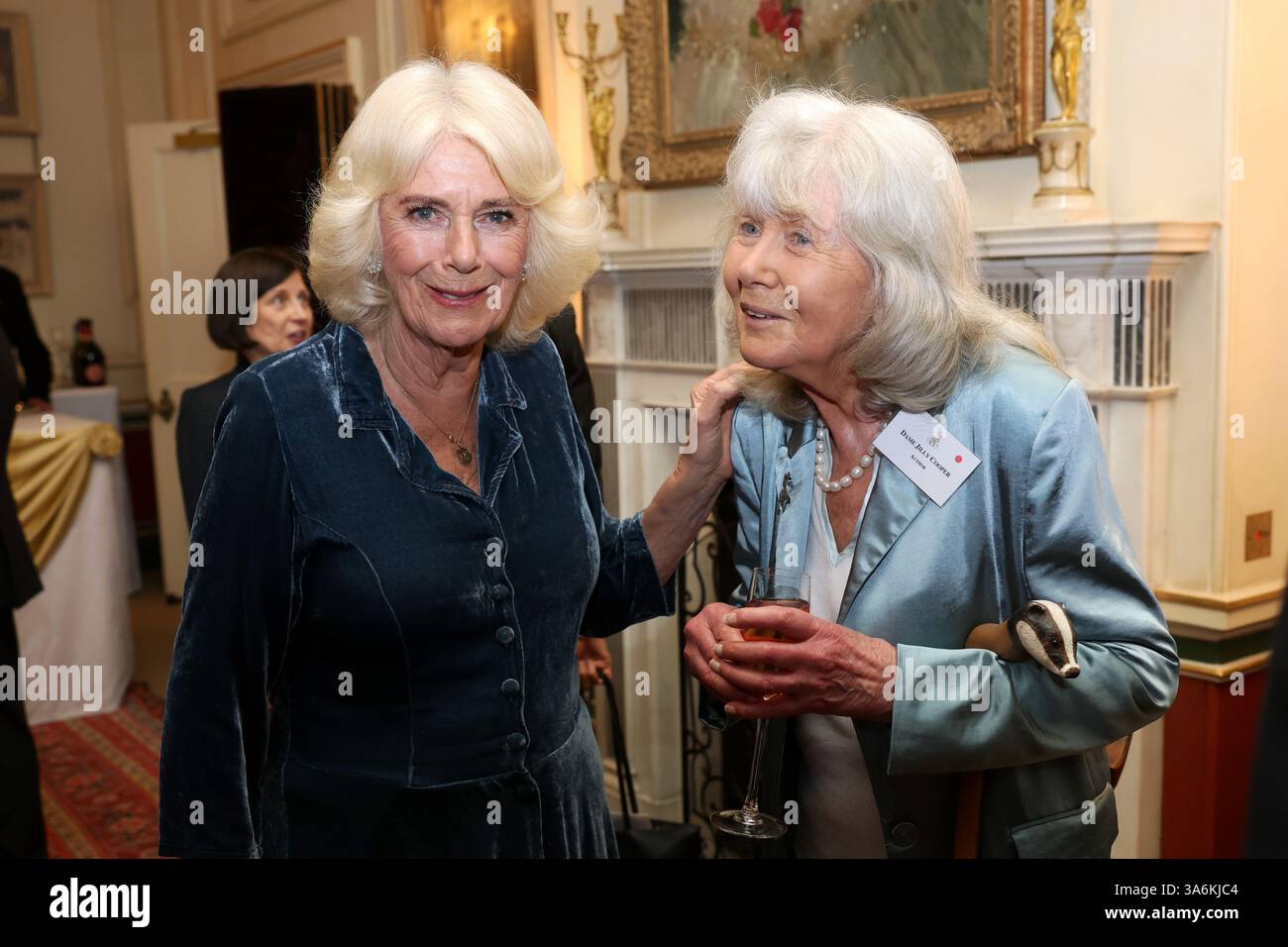 Queen Camilla and Dame Jilly Cooper during a reception at Clarence ...