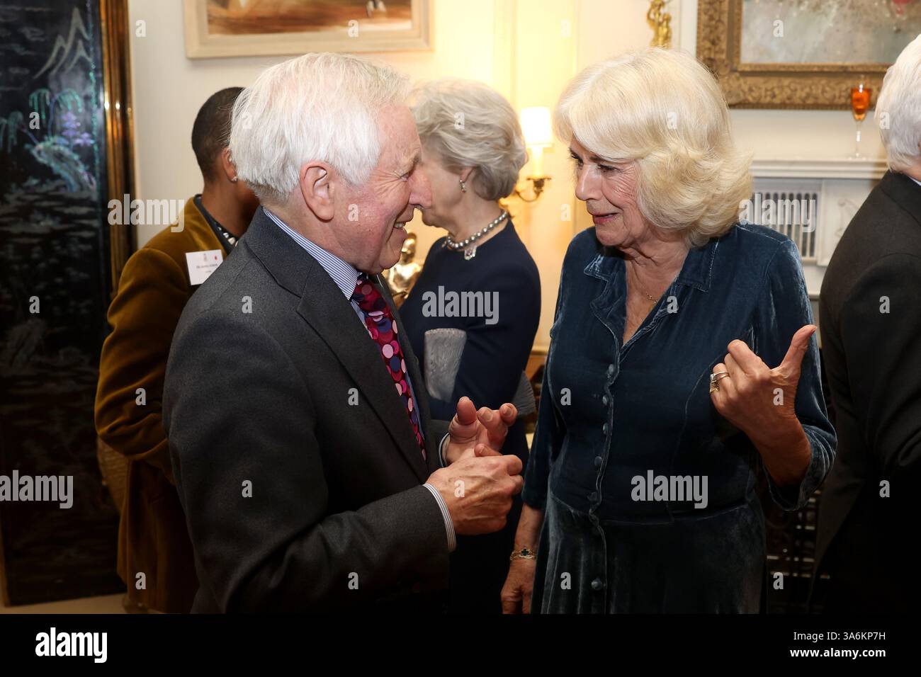 David Dimbleby speaks to Queen Camilla during a reception at Clarence ...