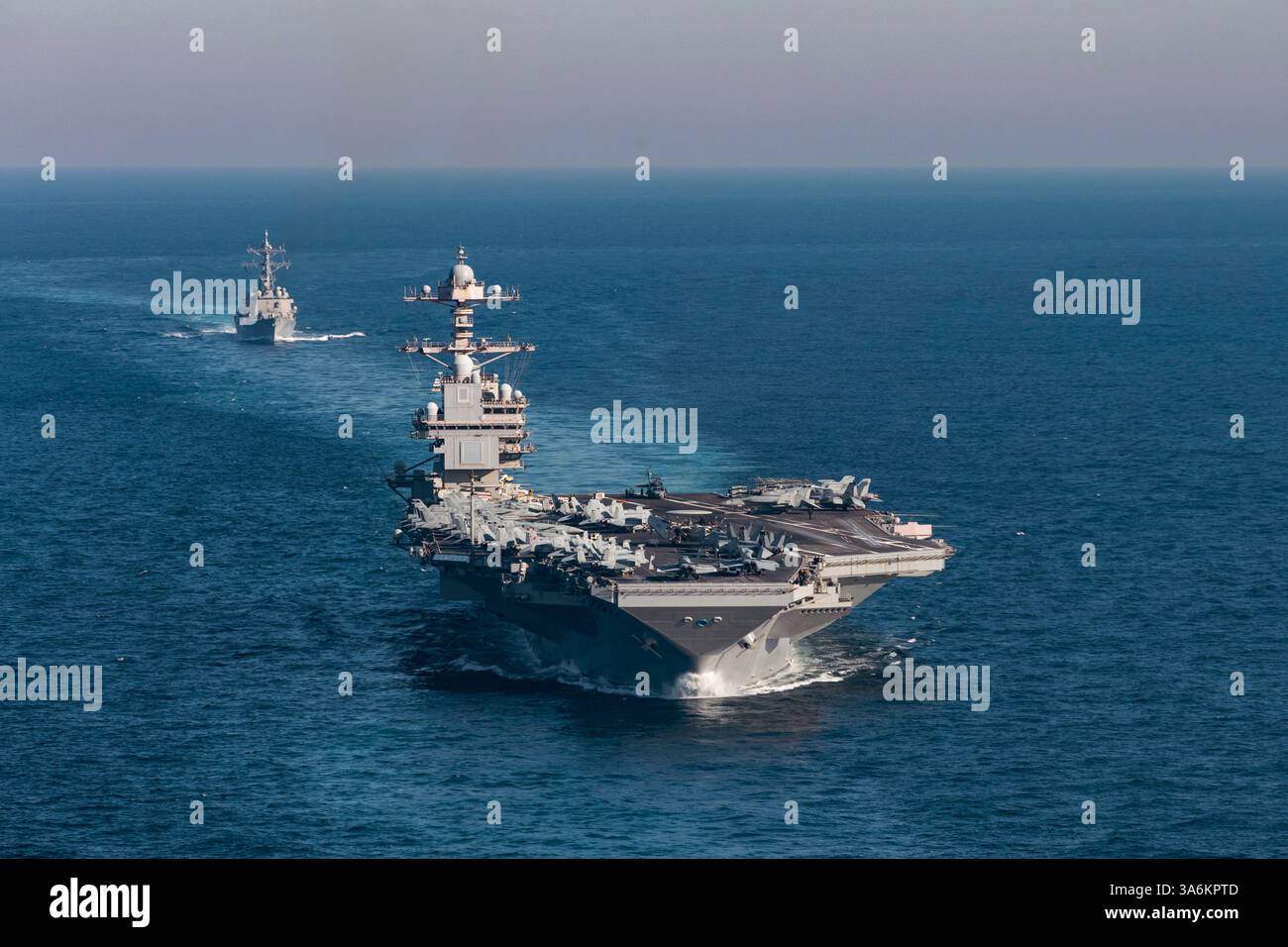 The world’s largest aircraft carrier, USS Gerald R. Ford (CVN 78) (front) and the Arleigh Burke ...