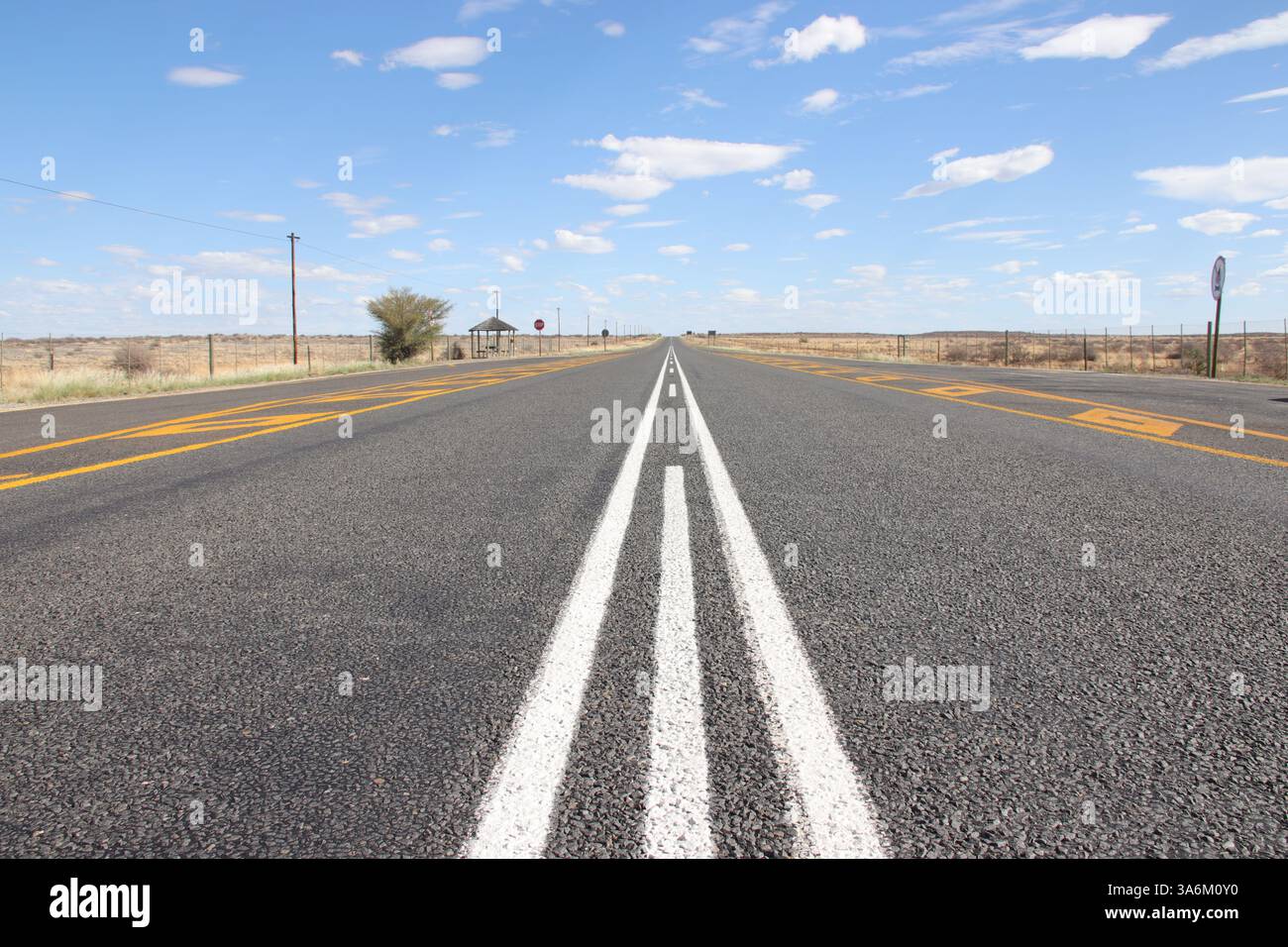 Straight road leading to town in South Africa Stock Photo - Alamy