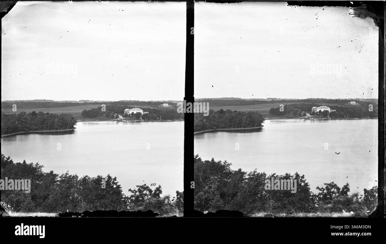 A scenic view of Lake Como in St. Paul, Minnesota, features a house ...