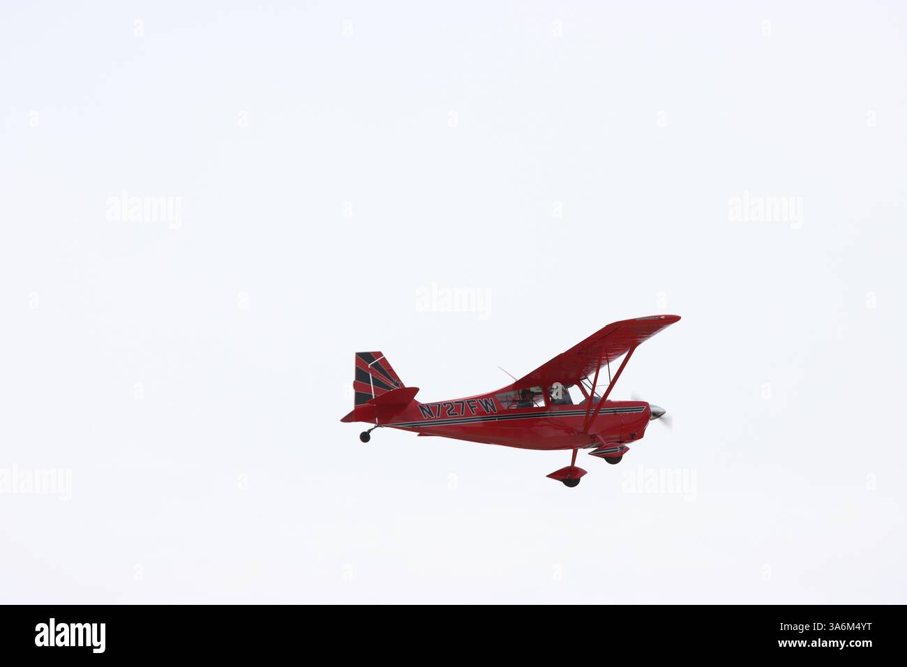 Red American Champion Super Decathlon in flight low side view Stock ...