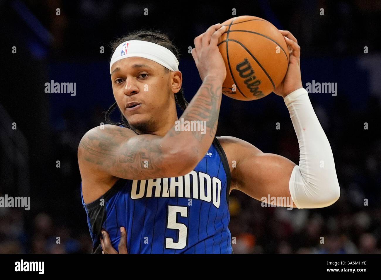 Orlando Magic forward Paolo Banchero looks to pass the ball during the second half of an NBA ...