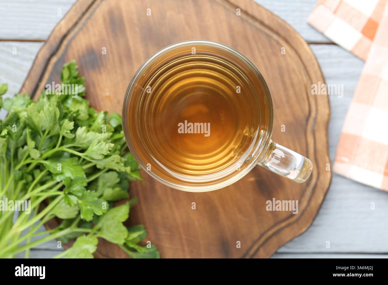 Healthy parsley tea on grey wooden table, top view. Detox drink Stock ...