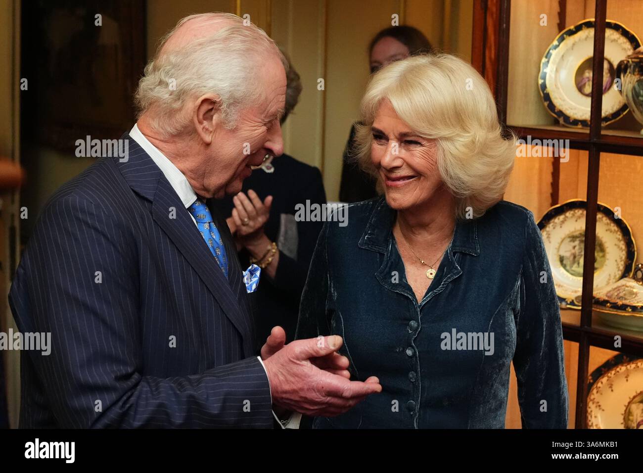 Queen Camilla, joined by King Charles III, during a reception at Clarence House, London, for ...