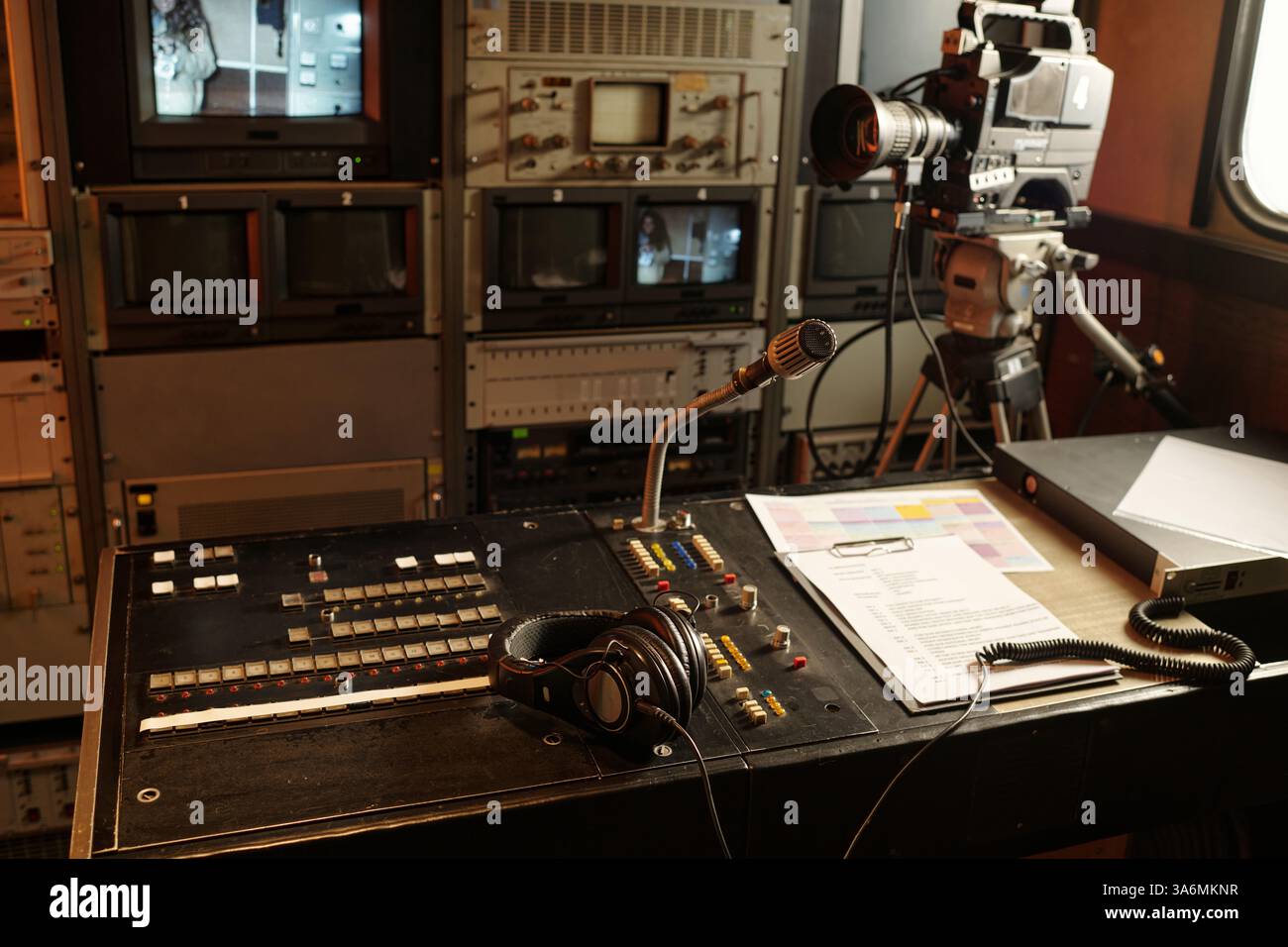 Microphone, headphones, text of scenario and broadcast schedule on ...