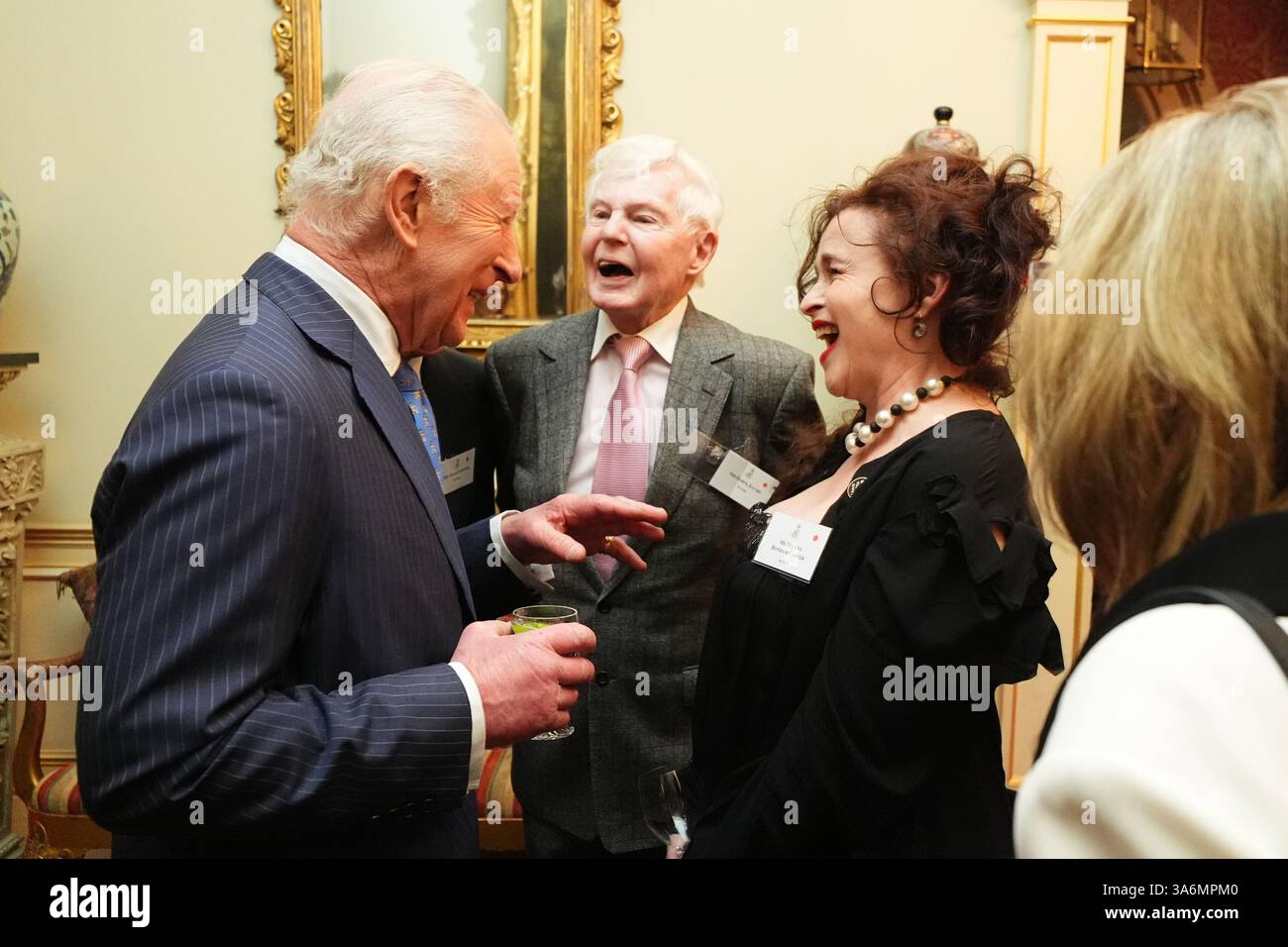 King Charles III with Sir Dreek Jacobi and Helena Bonham Carter during a reception at Clarence ...