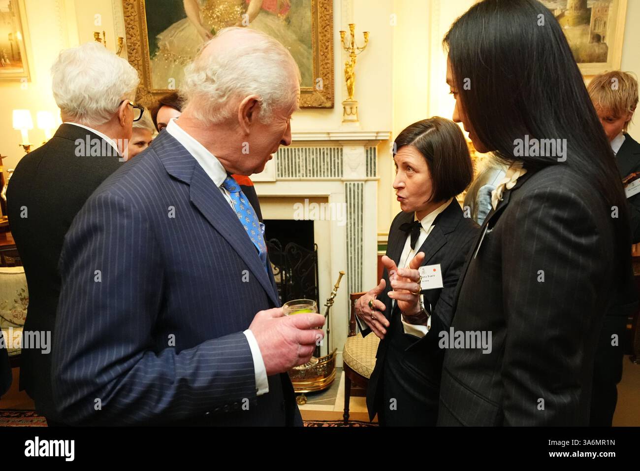 King Charles III with Donna Tartt and Min Jin Lee (right) during a reception at Clarence House ...