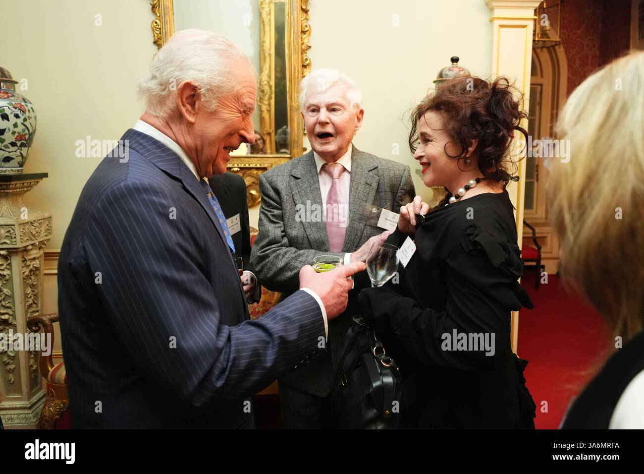 King Charles III with Sir Derek Jacobi and Helena Bonham Carter during a reception at Clarence ...