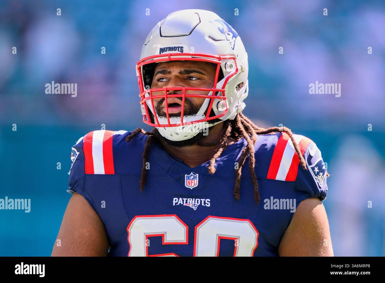 FILE - New England Patriots quarterback center Lecitus Smith (68) walks ...