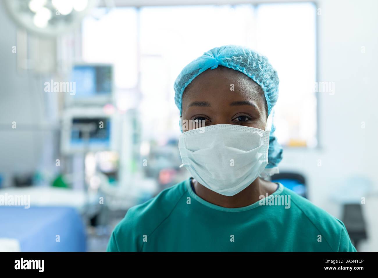 Healthcare professional wearing mask and scrubs in hospital operating ...