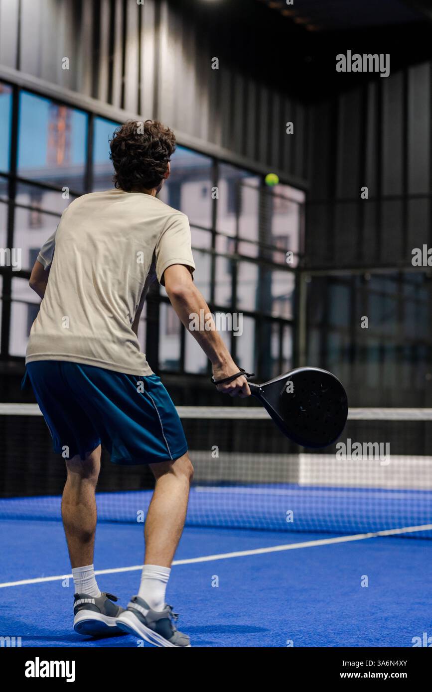Playing padel tennis man focusing hi-res stock photography and images ...