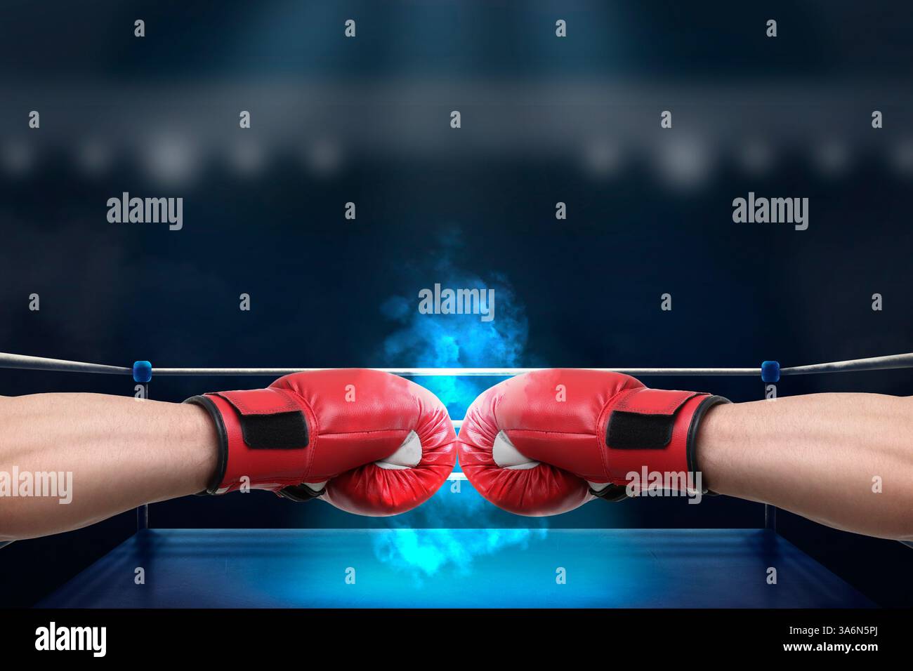 Boxers fighting in boxing ring, closeup. Smoke between their hands ...