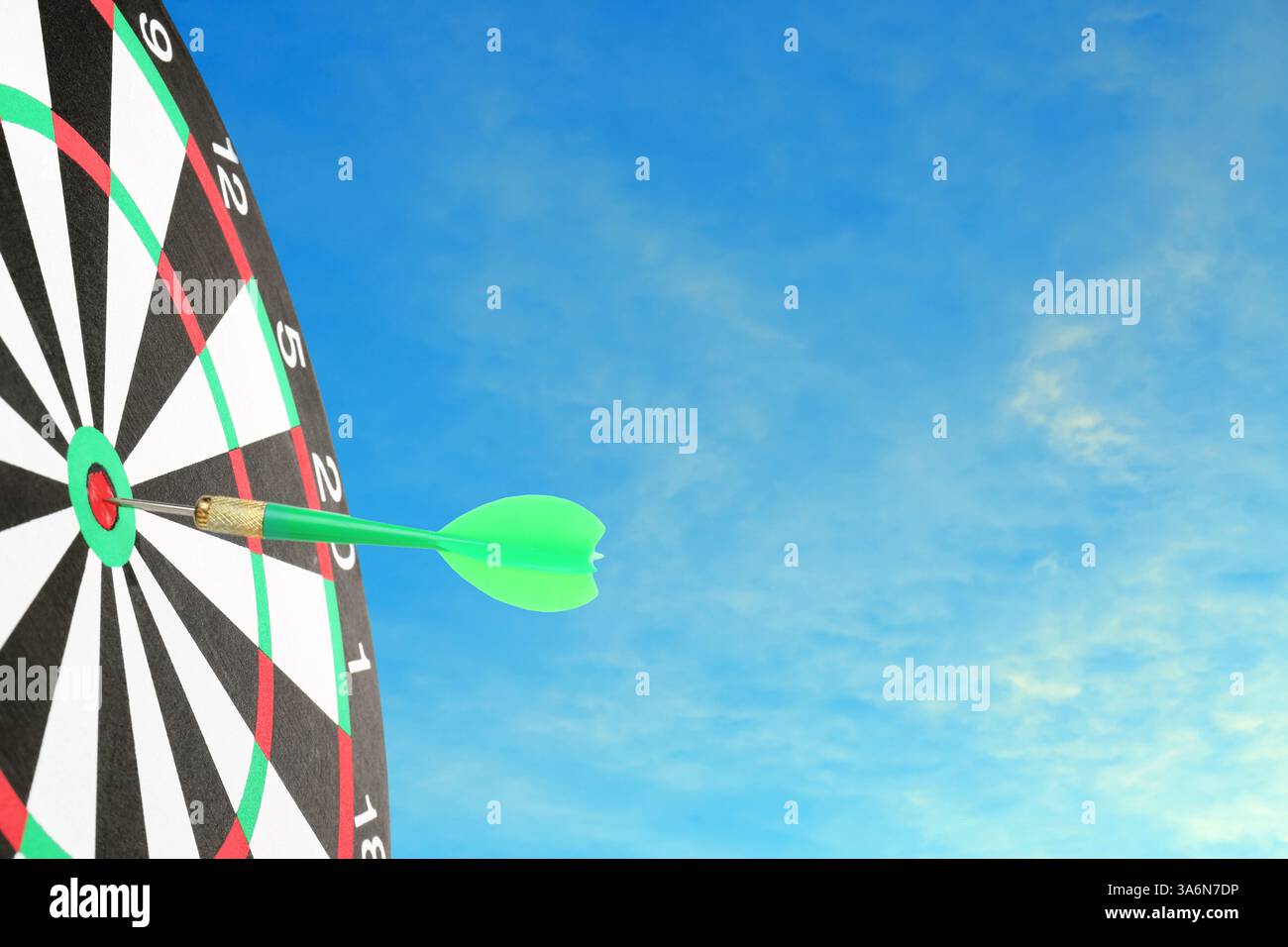 Dart board with arrow against blue sky. Concepts of targeting, decision ...
