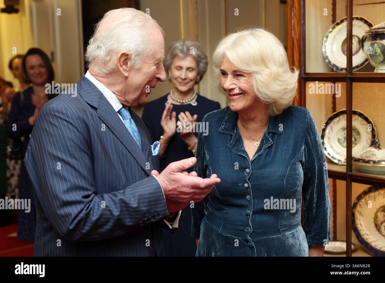 Queen Camilla, joined by King Charles III, during a reception at Clarence House, London, for ...