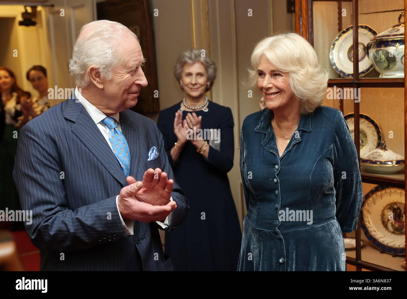 Queen Camilla, joined by King Charles III, during a reception at Clarence House, London, for ...