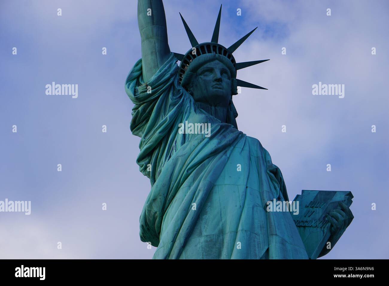 Close up of the head, face, and crown of the Statue of Liberty holding ...