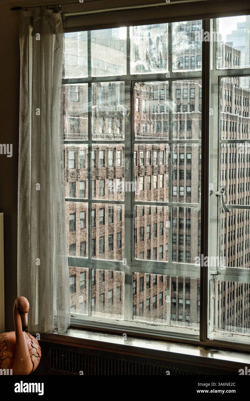 Dirty New York City apartment casement windows Stock Photo - Alamy