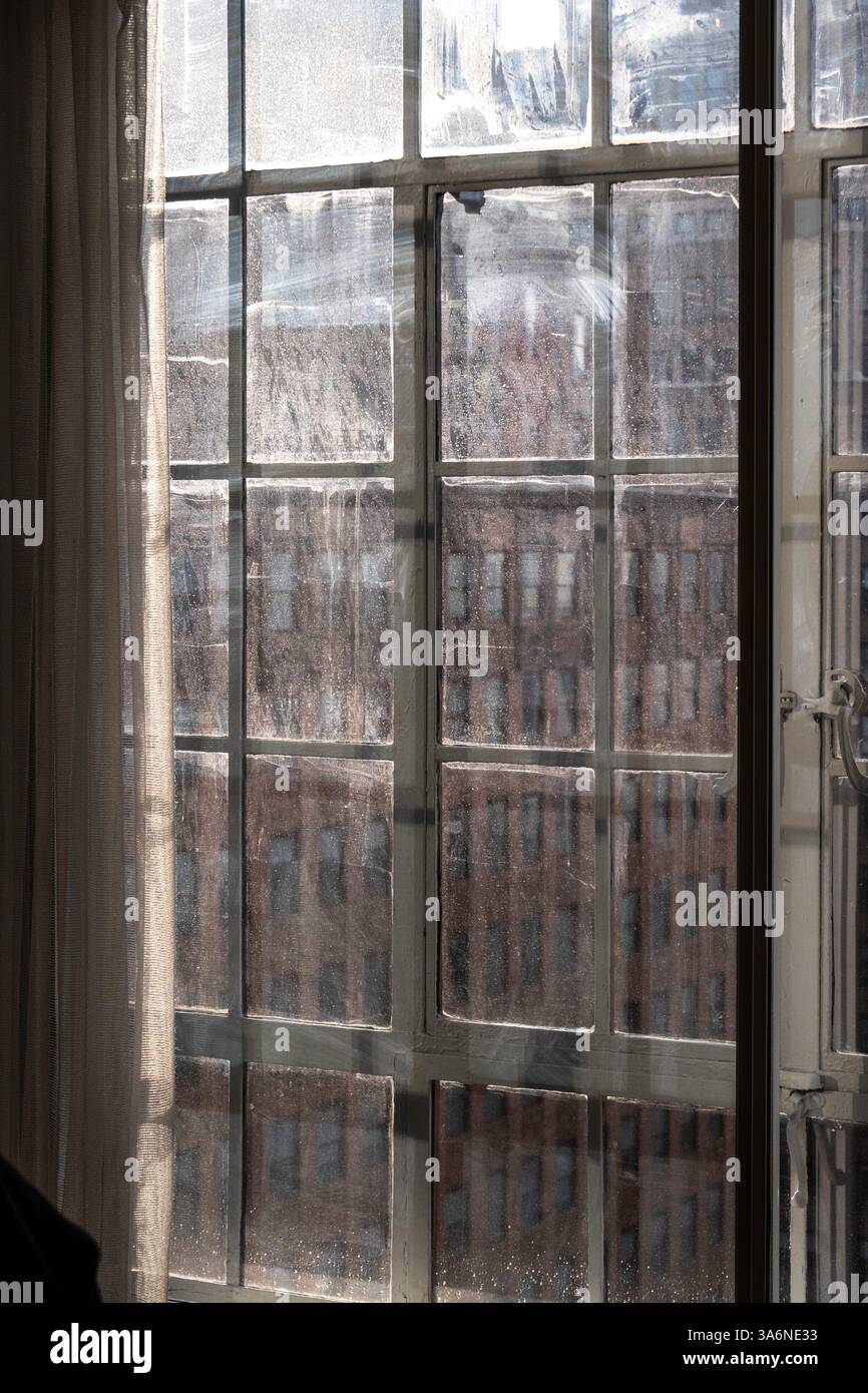 Dirty New York City apartment casement windows Stock Photo - Alamy