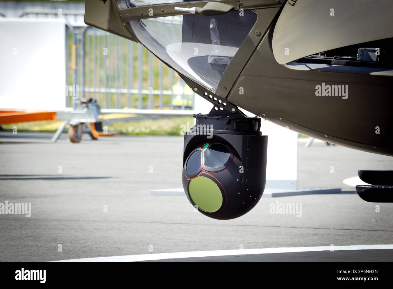 Camera sensor pods under an aerial surveillance helicopter Stock Photo ...