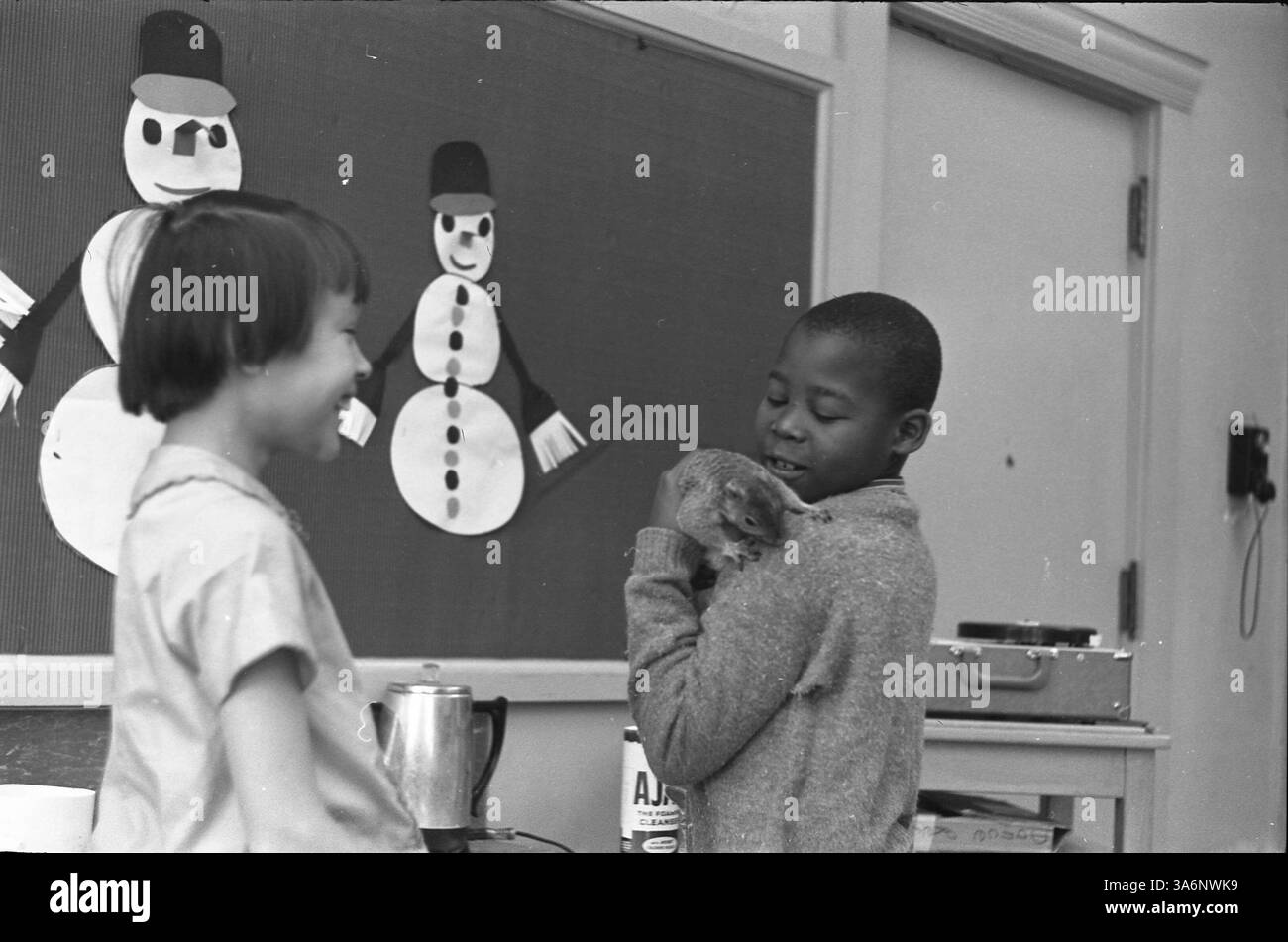 This photograph from Cleveland School shows two students interacting ...
