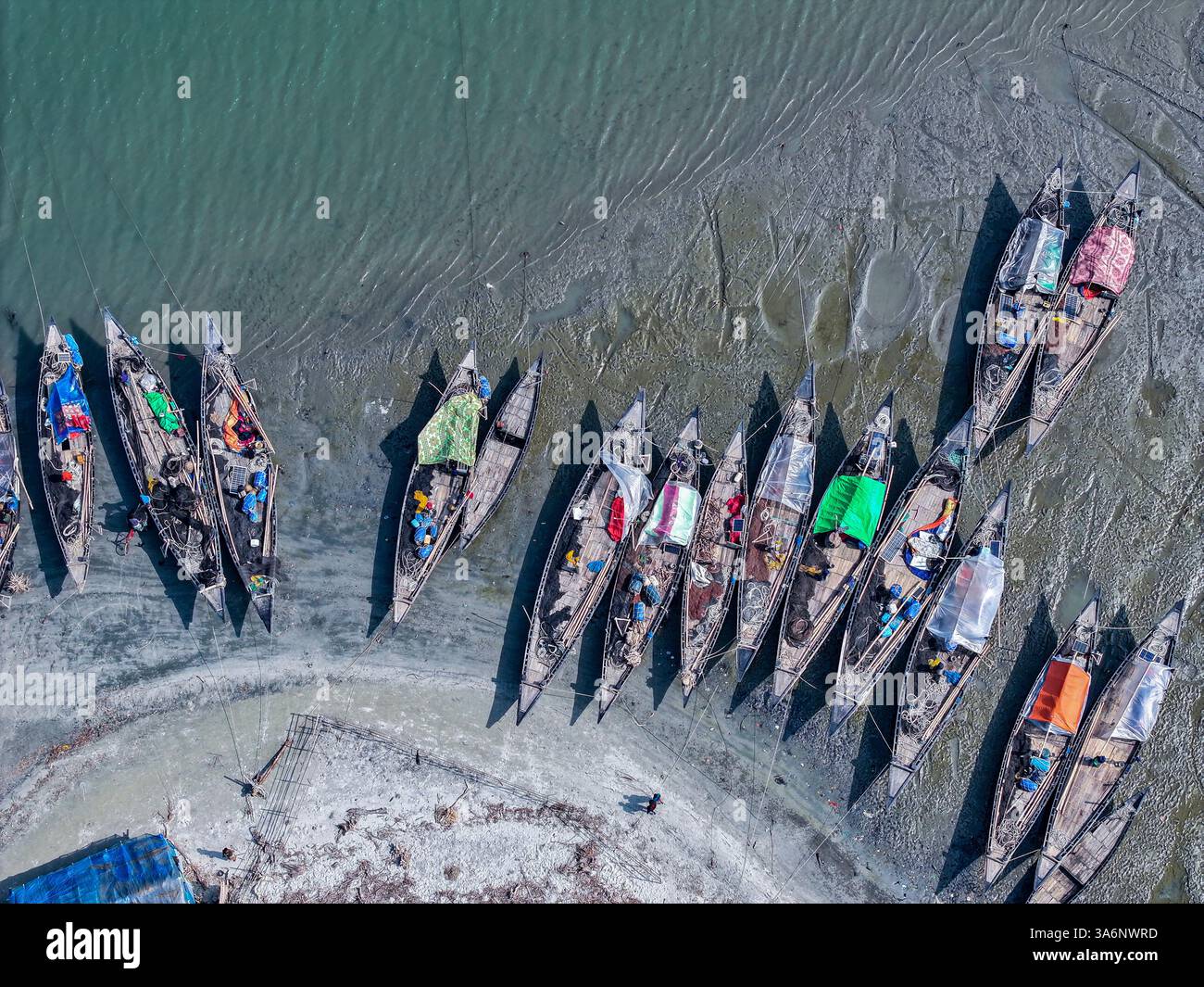 Fishing boats anchored along the shore of the Shutki (dried fish ...