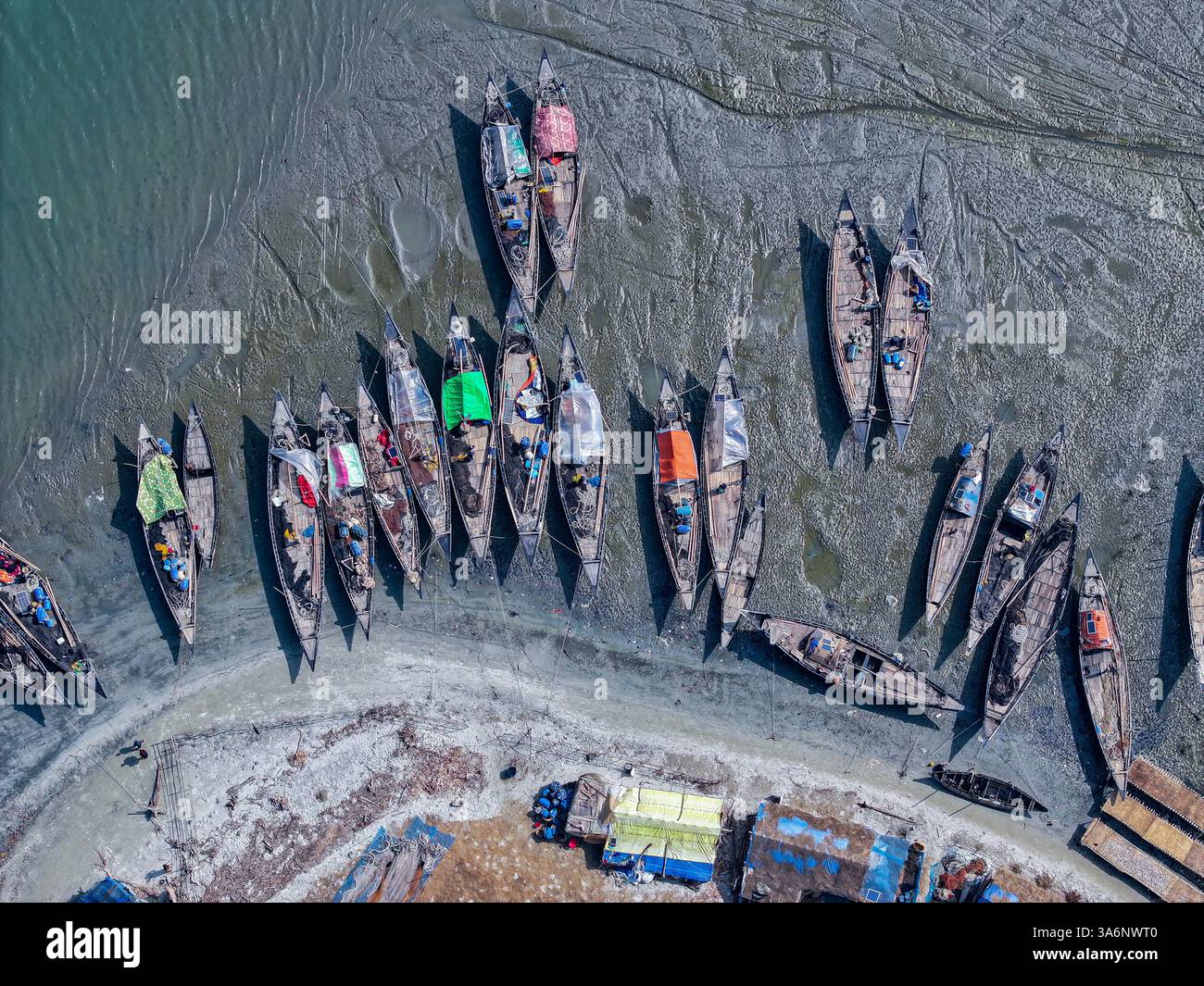Fishing boats anchored along the shore of the Shutki (dried fish ...