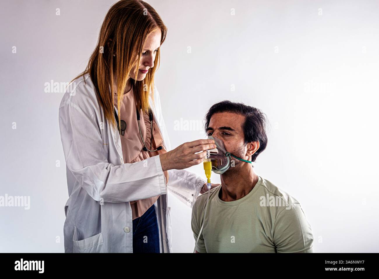 Female doctor placing oxygen mask on patient experiencing breathing ...