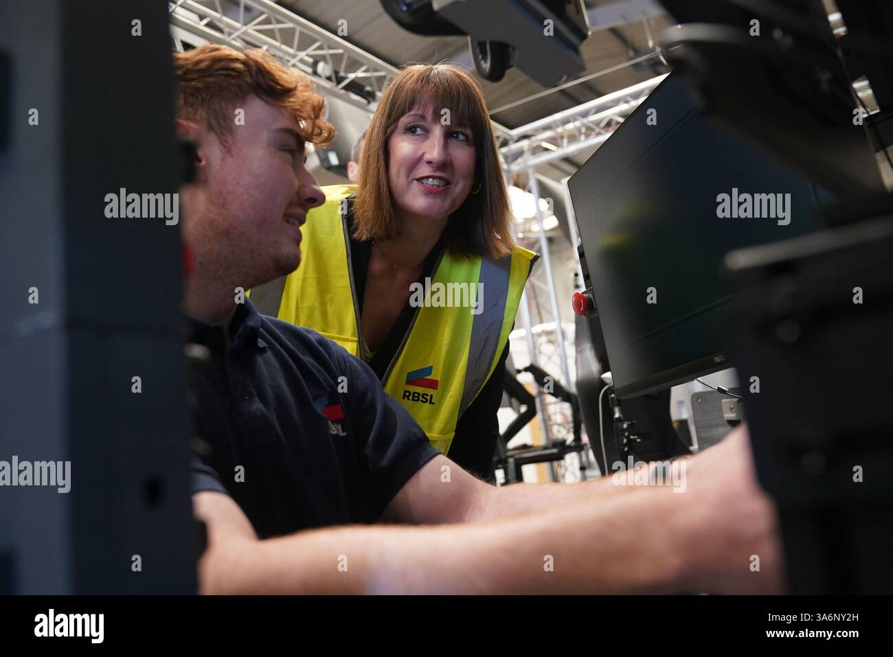 Chancellor of the Exchequer Rachel Reeves is shown a simulator during a ...