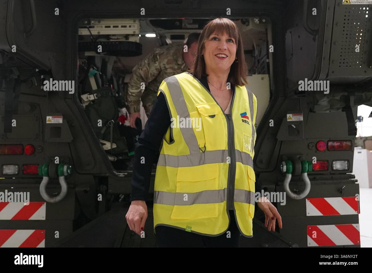 Chancellor of the Exchequer Rachel Reeves is shown a military vehicle ...