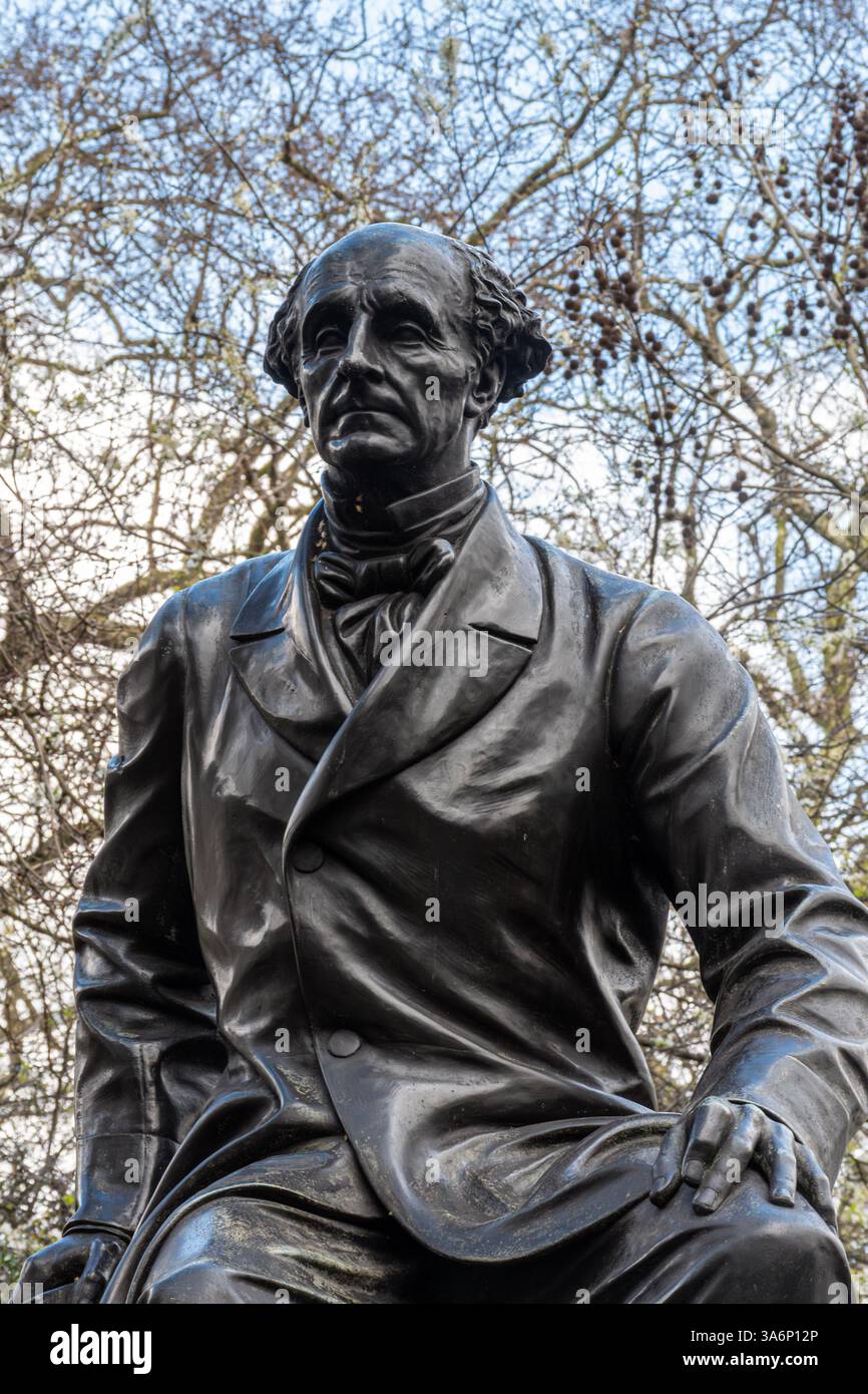 John Stuart Mill statue, a liberal politician, a bronze statue on stone ...