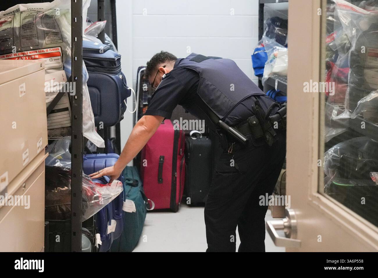 Canada Border Services Agency staff member is seen in the storage room ...