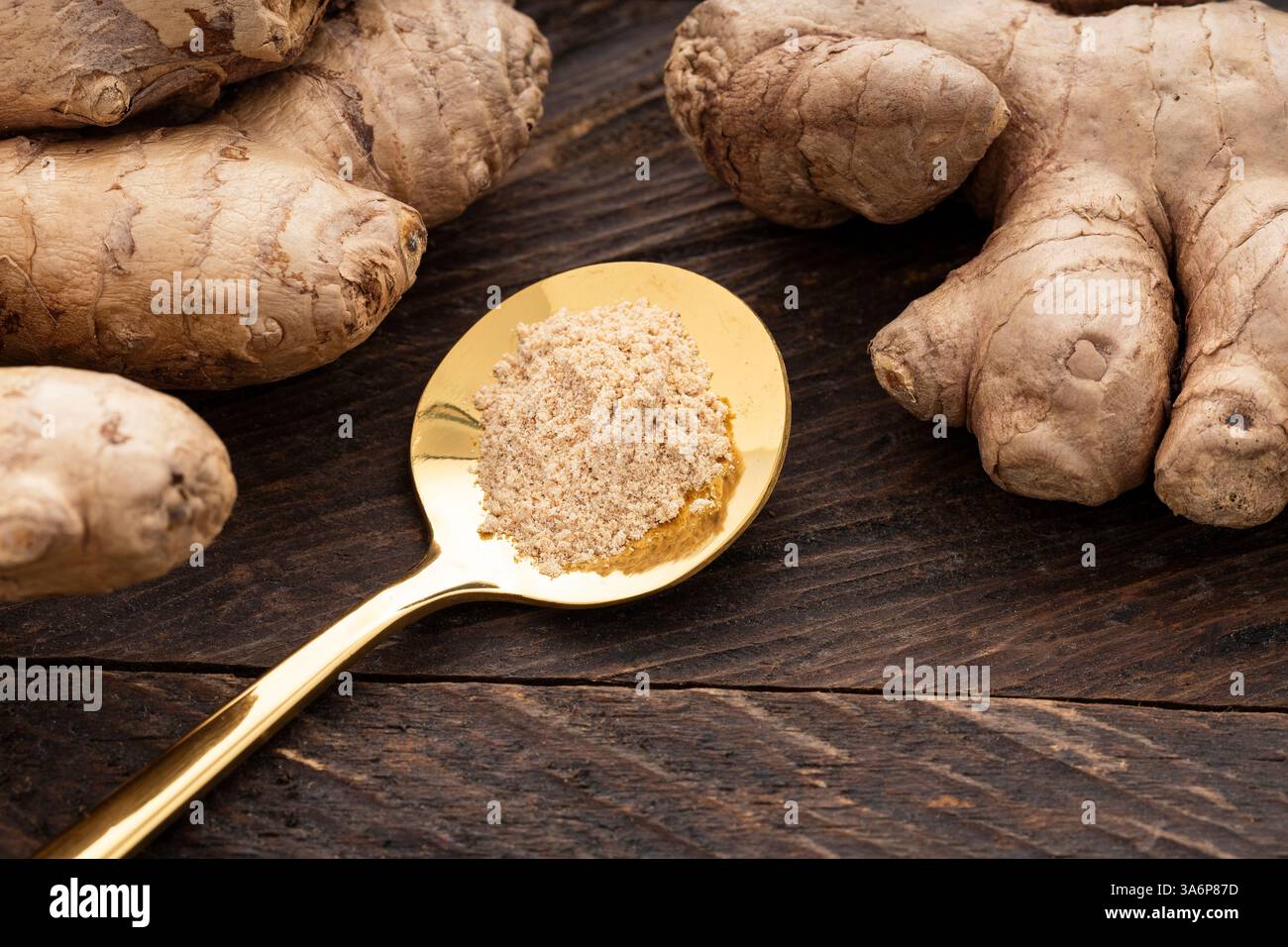Fresh ginger root - Zingiber officinale ground Stock Photo - Alamy