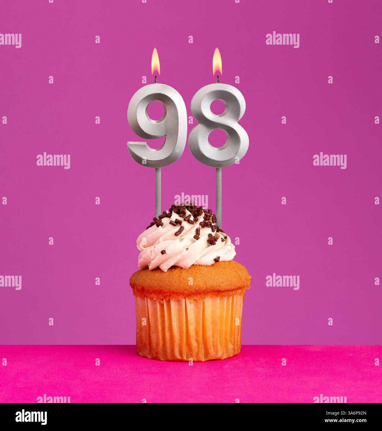 Birthday card on violet background - Candle number 98 Stock Photo - Alamy