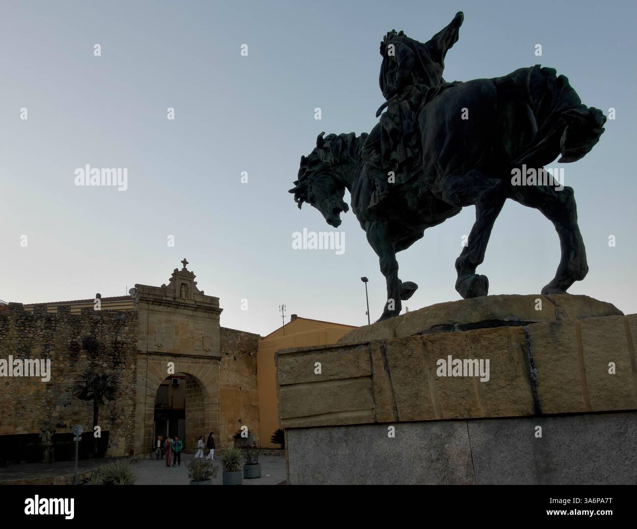Evening view of a bronze statue of King Alfonso VIII of Castilla on ...