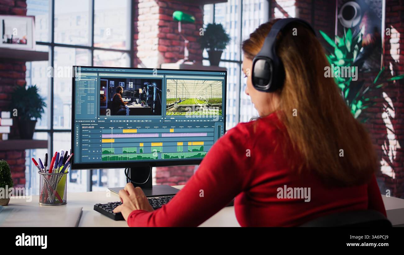 Female filmmaker working on media post production from agency office ...