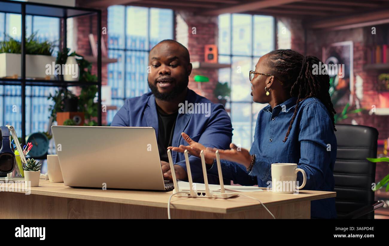 Angry African American people tries to reset the Wi Fi modem due to ...