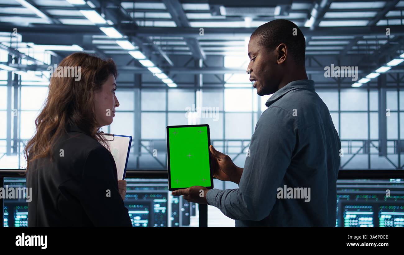 Server Room Data Scientists Using Mockup Tablet Conducting Security