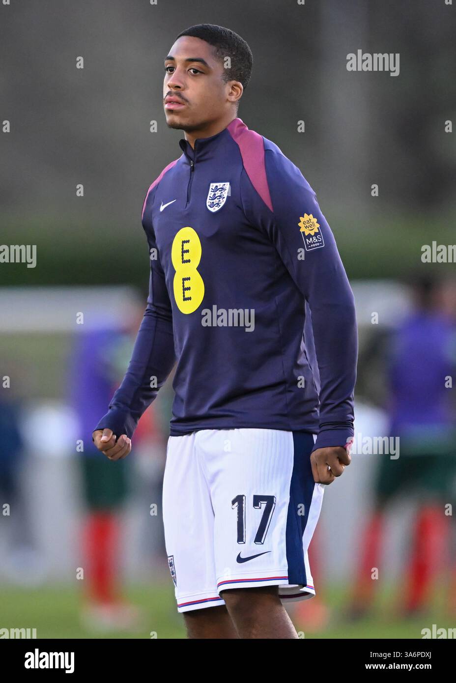 Deeside, UK. 25th Mar, 2025. Caleb Kporha of England warms up ahead of ...