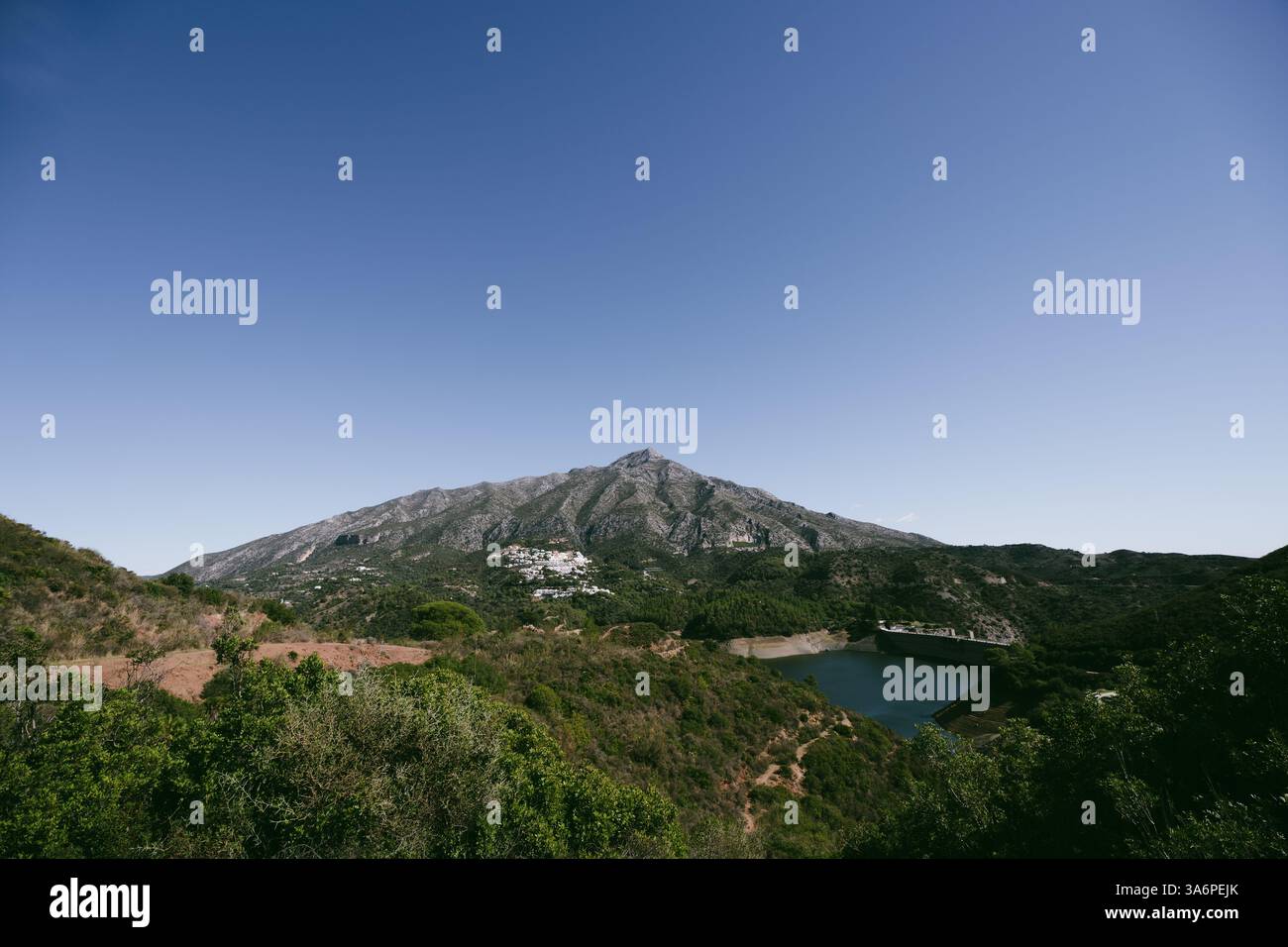 Scenic mountain landscape with reservoir and clear blue sky, La ...