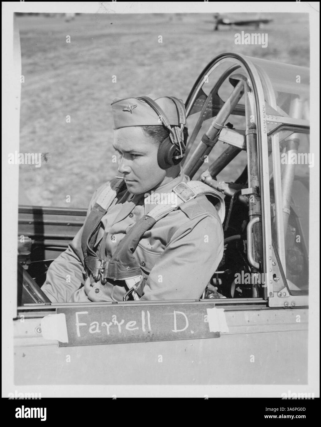 David Farrell is pictured sitting in the cockpit of a military airplane ...