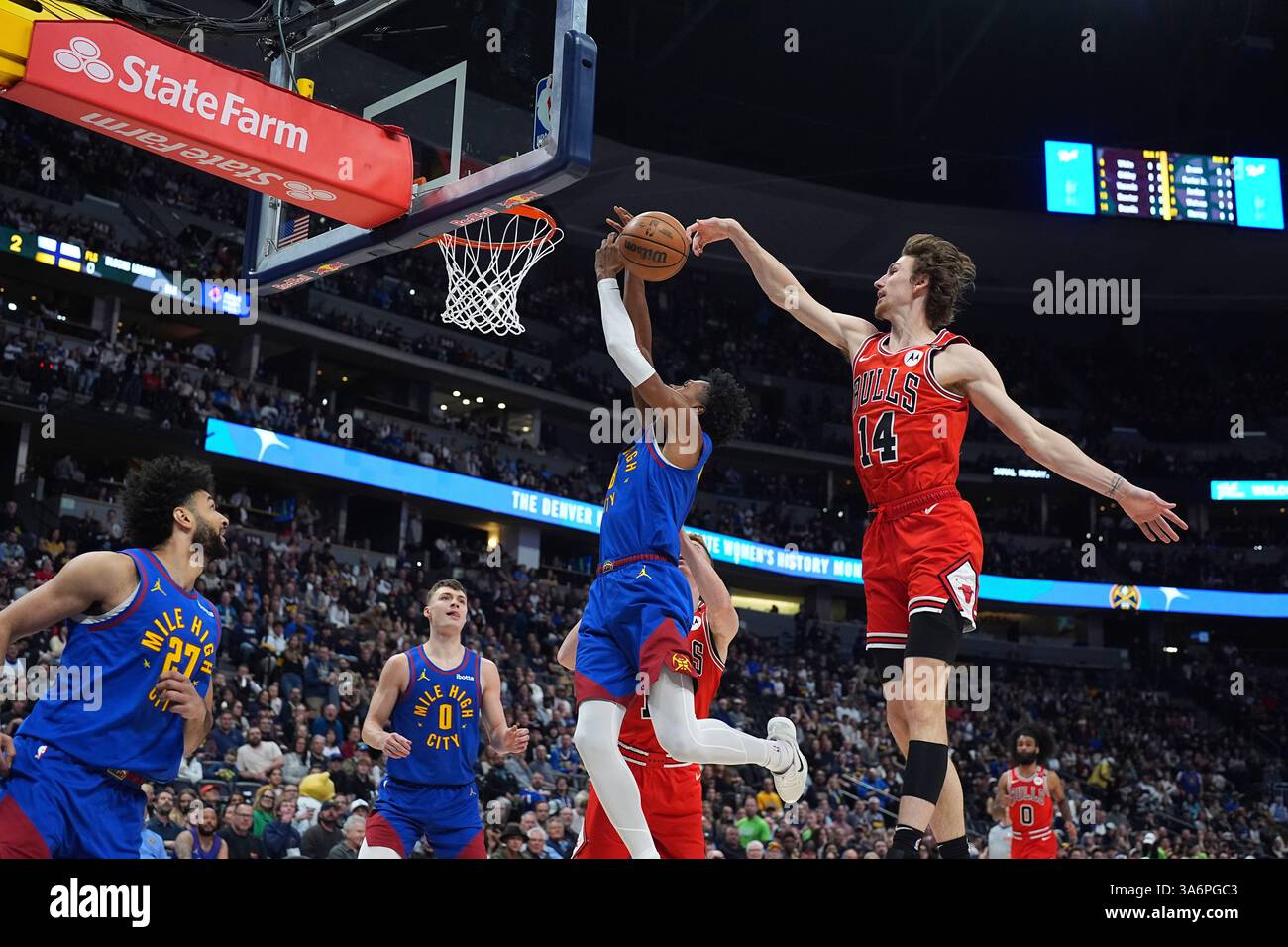 Chicago Bulls forward Matas Buzelis (14) blocks a shot by Denver ...