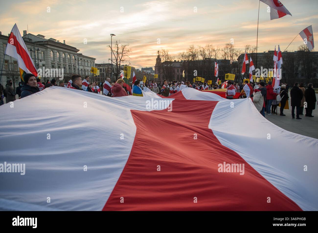 Vilnius, Lithuania. 25th Mar, 2025. People hold a huge Belarusian ...